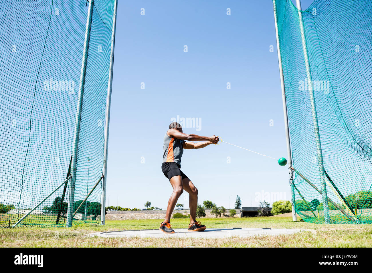 Athlete performing a hammer throw Stock Photo - Alamy