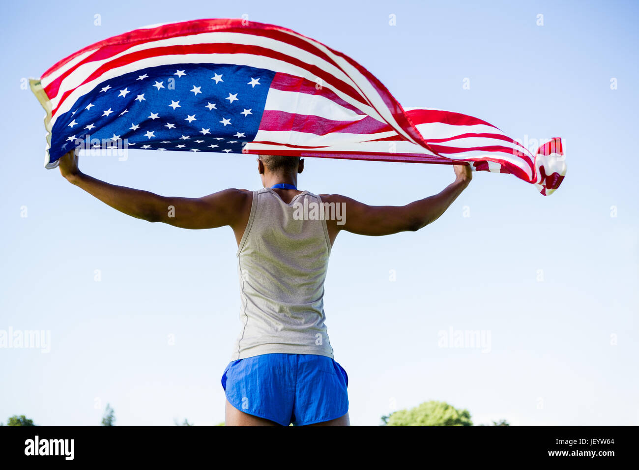 Athlete and flag hi-res stock photography and images - Alamy
