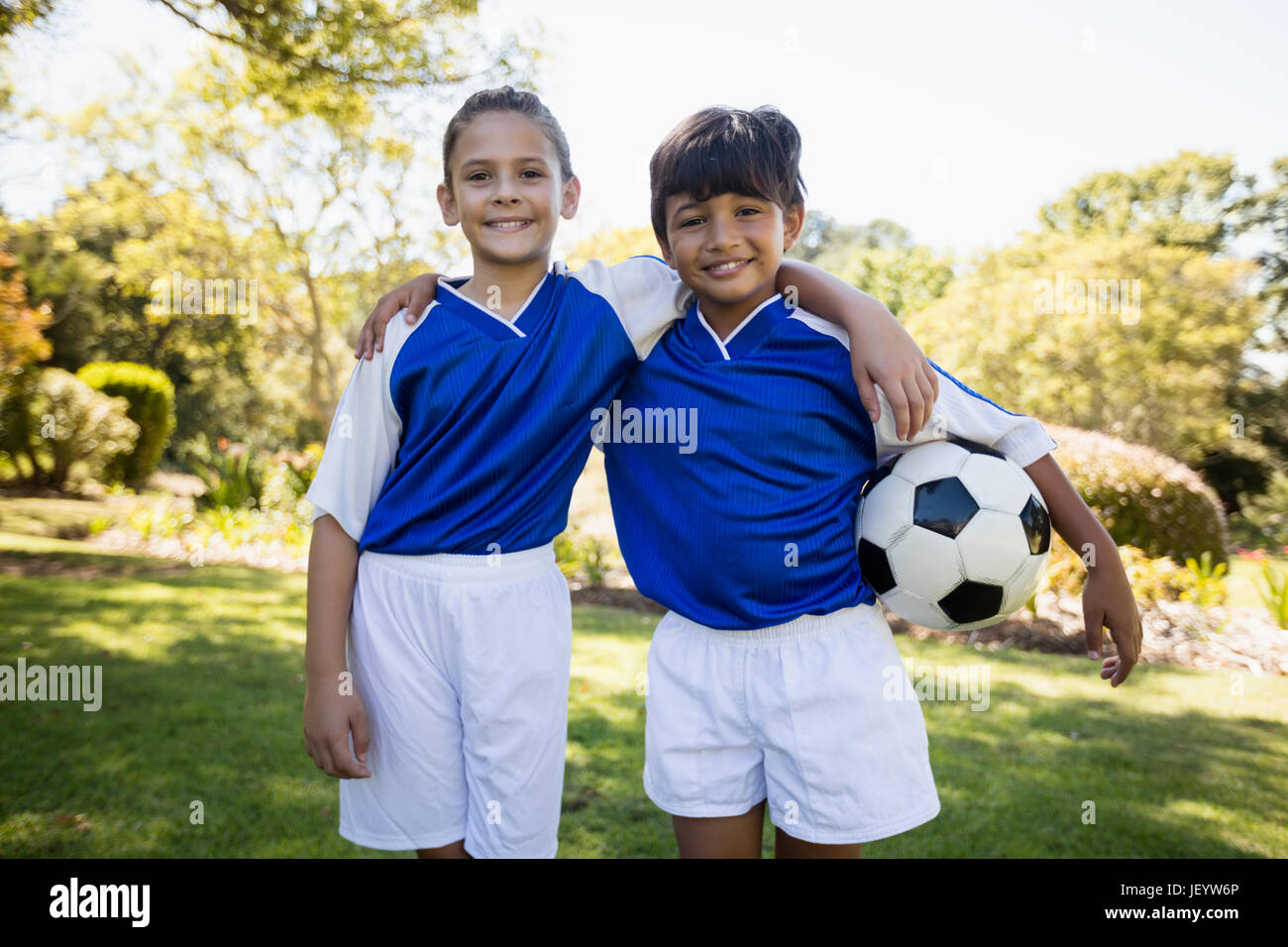 Portrait of two children smiling at camera Stock Photo - Alamy