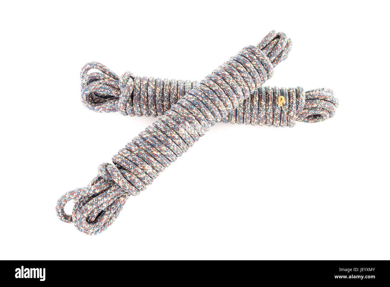 Twisted thick rope on white Stock Photo - Alamy