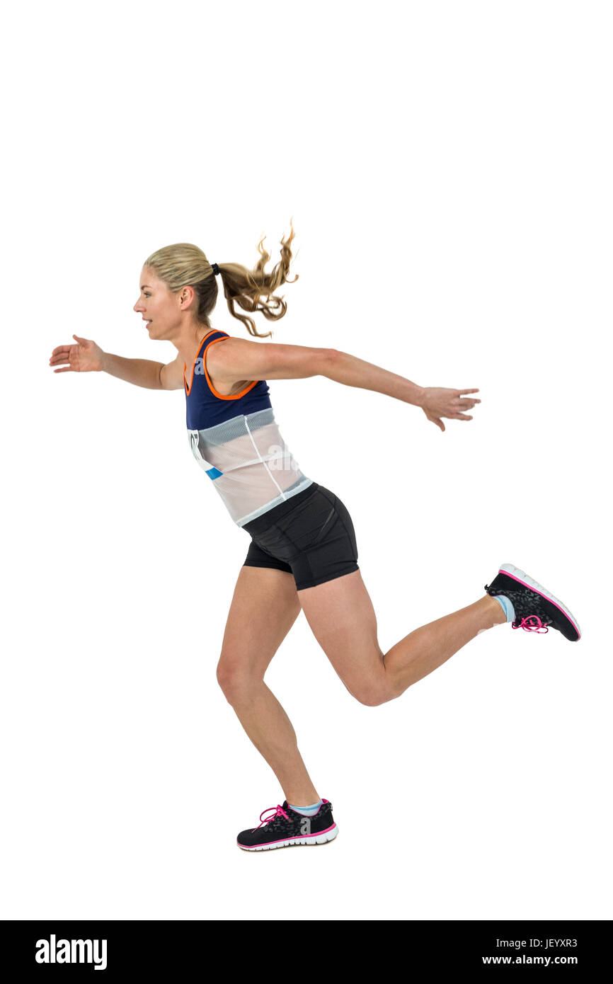 Female athlete running on white background Stock Photo - Alamy