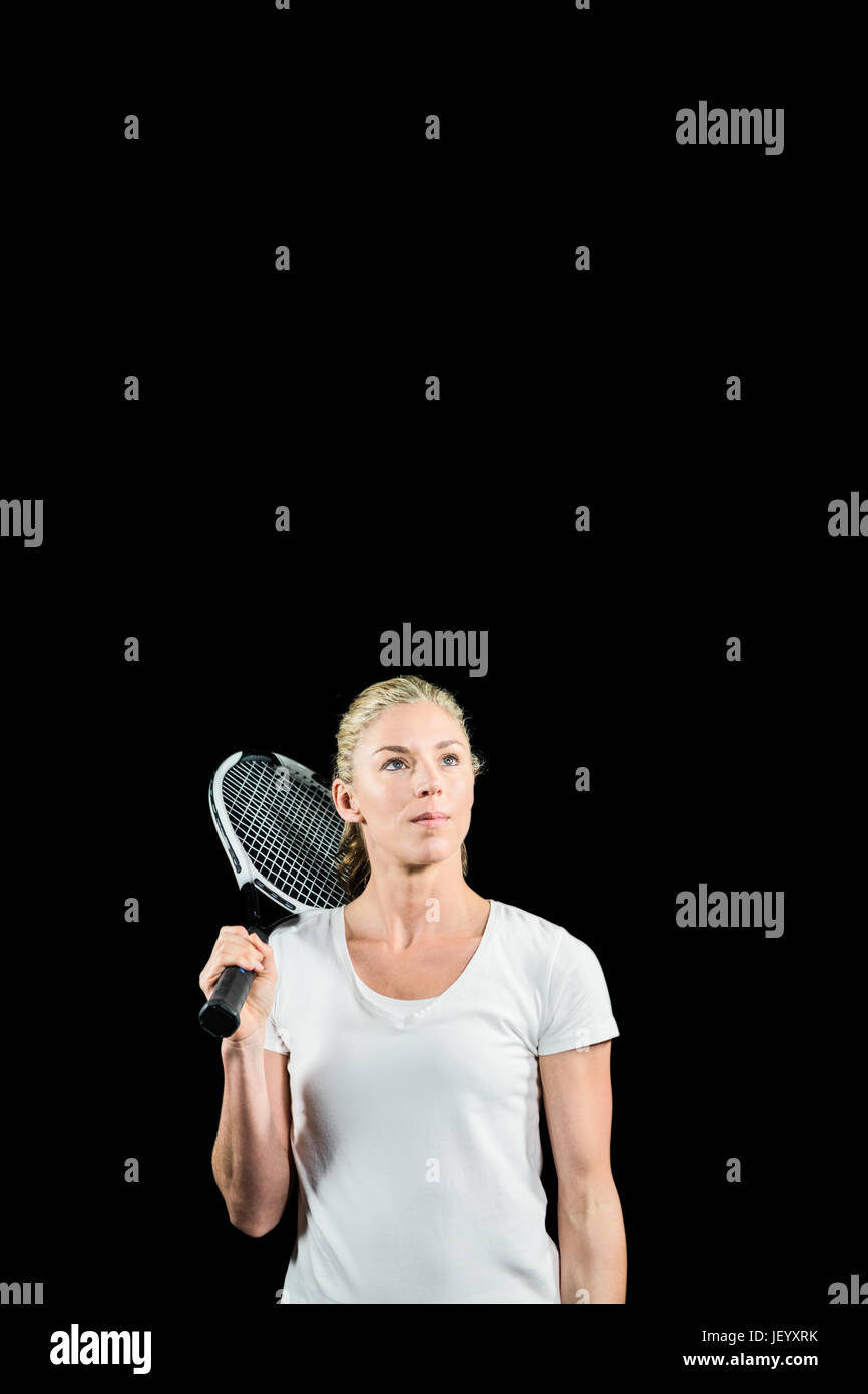 Female tennis player posing with racket Stock Photo - Alamy