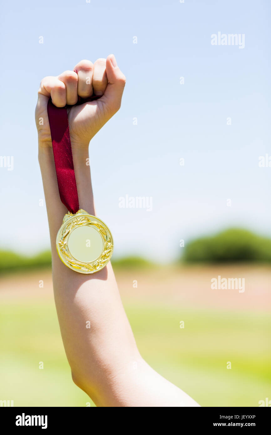 Medal olympics hand hi-res stock photography and images - Alamy
