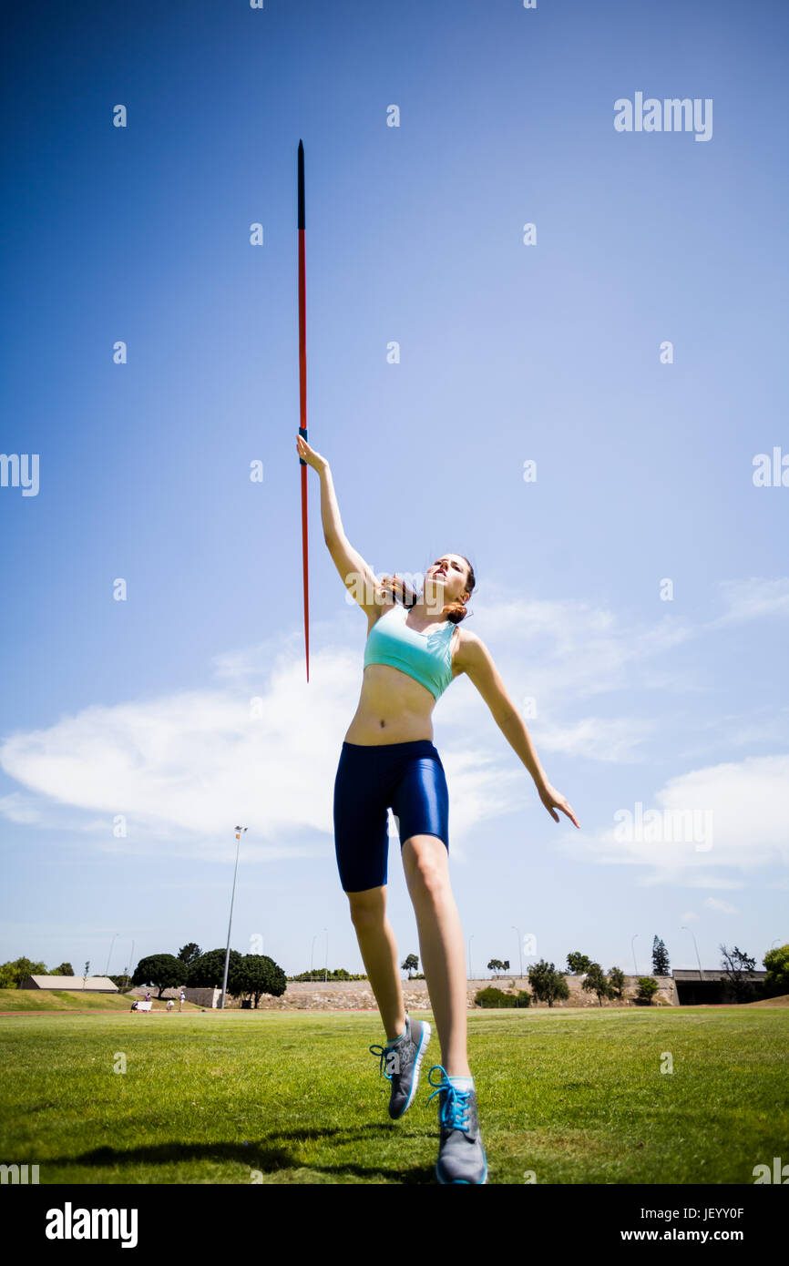 Female athlete throwing a javelin Stock Photo - Alamy