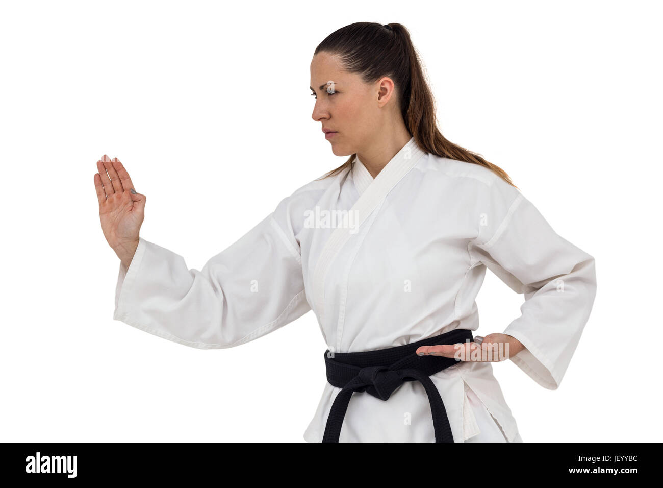 Female fighter performing karate stance Stock Photo - Alamy