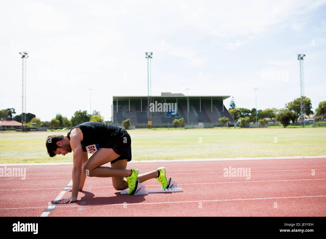 Athlete ready to run Stock Photo - Alamy