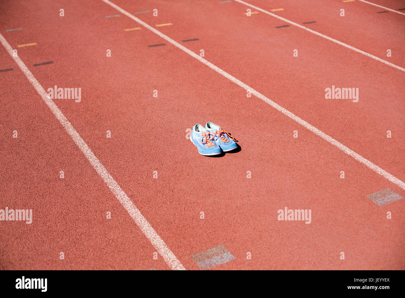 Sport shoes on running track Stock Photo - Alamy