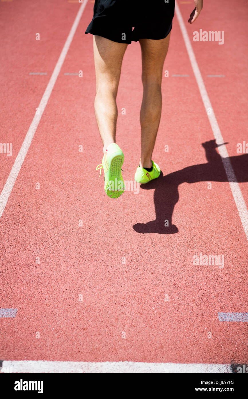 Athlete running on the racing track Stock Photo - Alamy