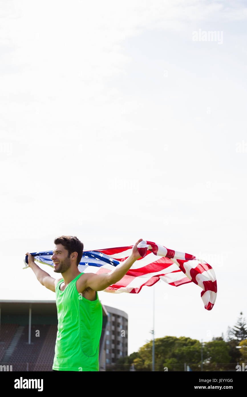 Athlete posing with american flag Stock Photo - Alamy