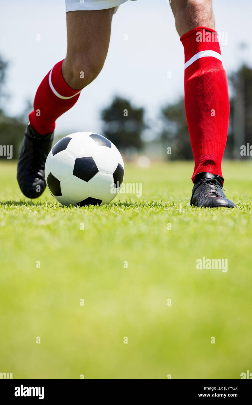 Football player practicing soccer Stock Photo - Alamy