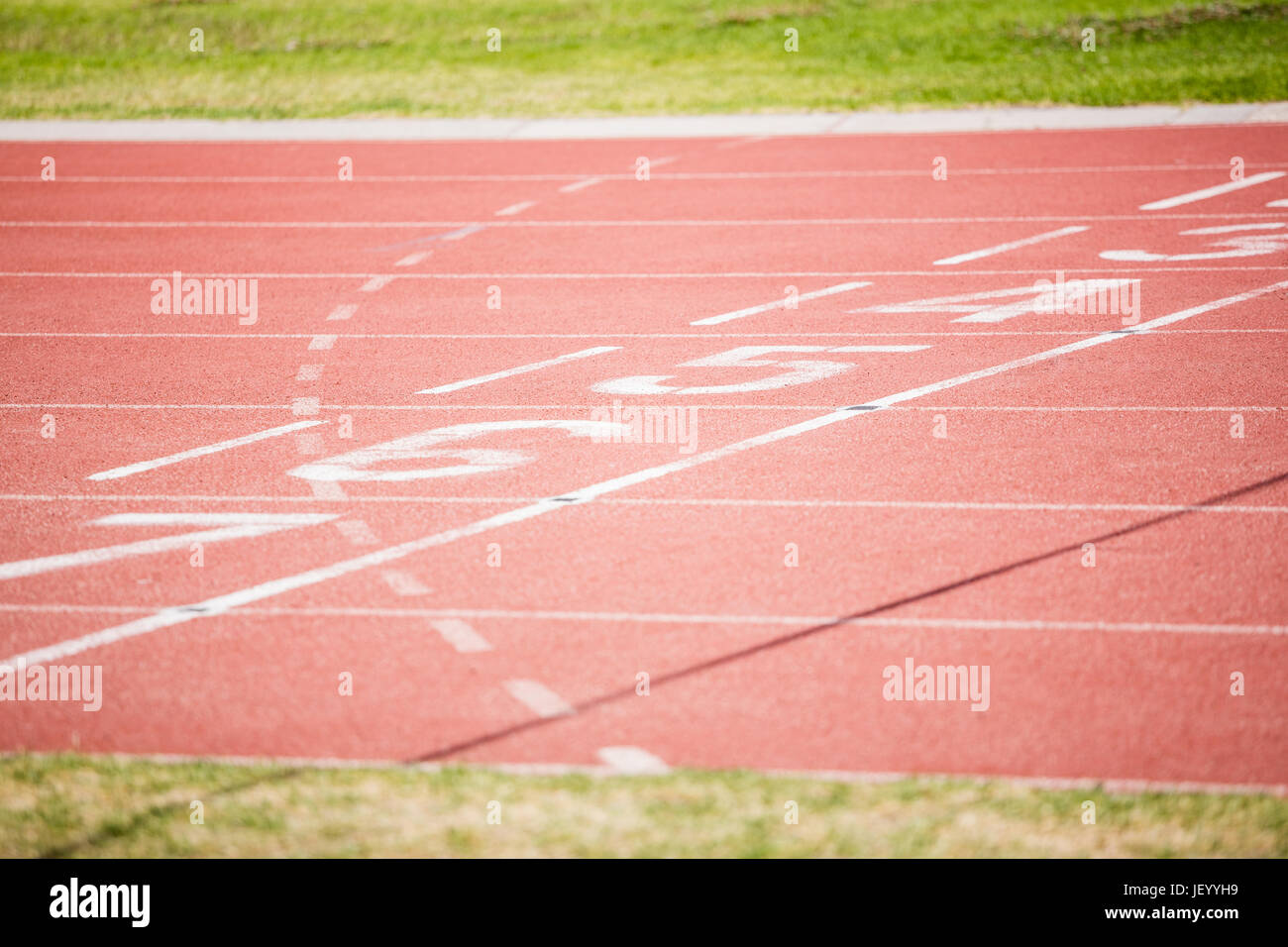 The beginning of the running track Stock Photo - Alamy