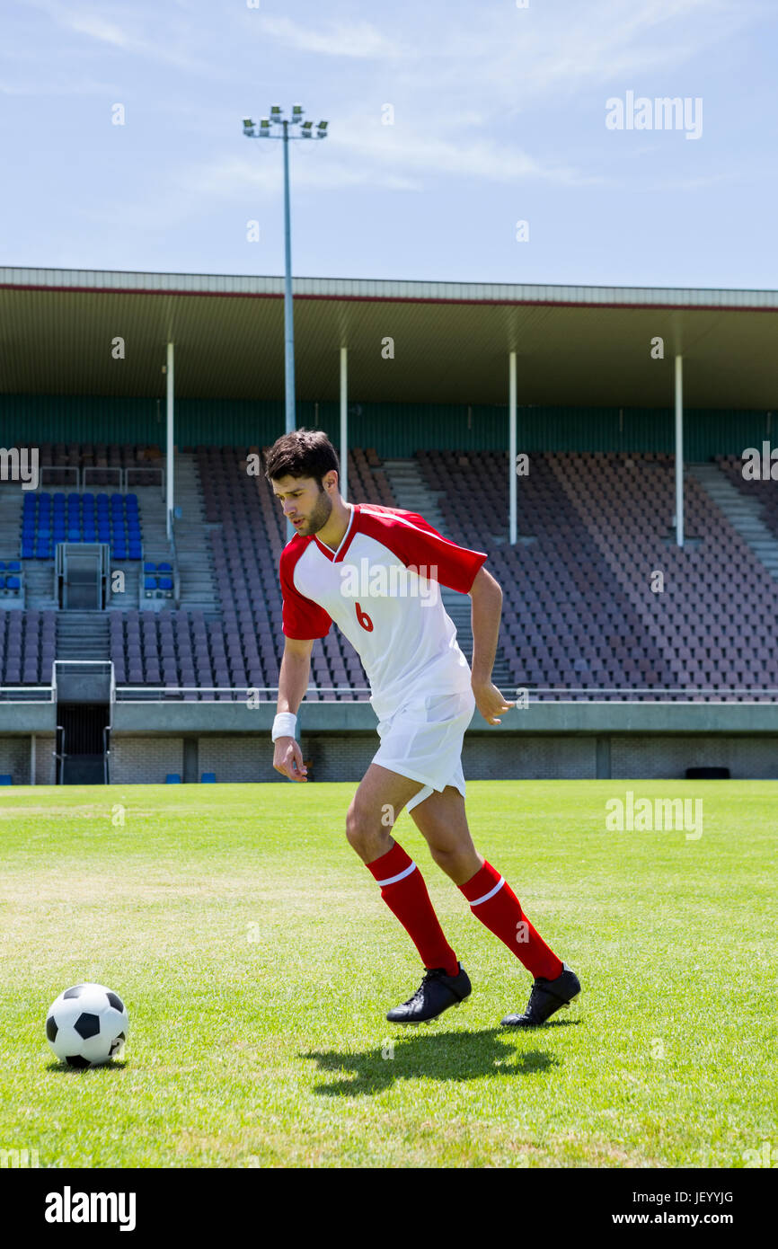 Football player practicing soccer Stock Photo - Alamy