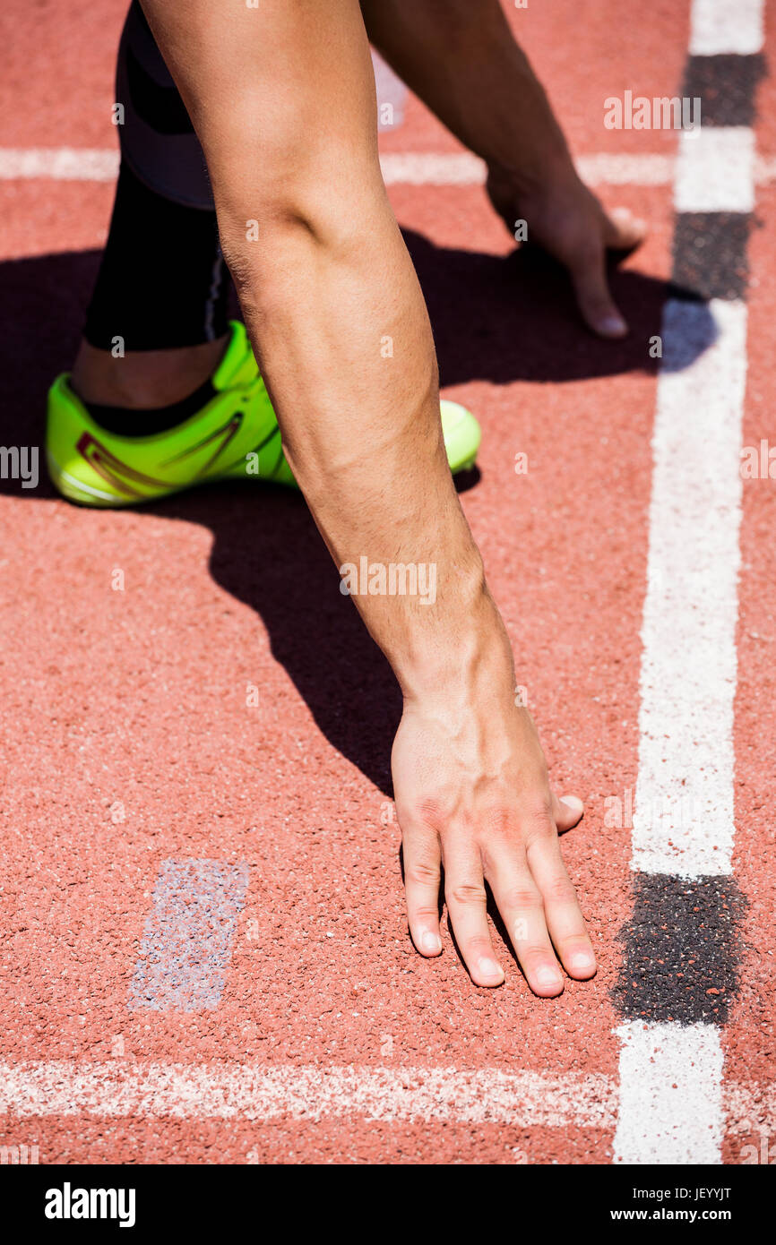 Athletes hands on a starting block Stock Photo - Alamy