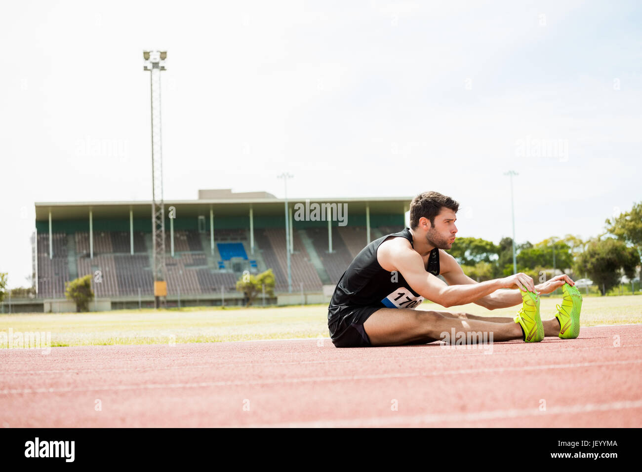 Athlete doing stretching exercise Stock Photo - Alamy