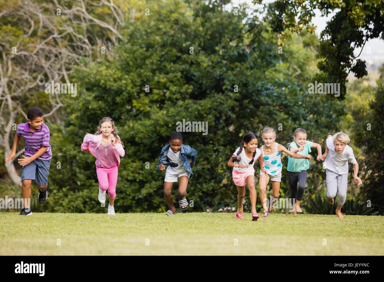 Kids playing together during a sunny day Stock Photo - Alamy