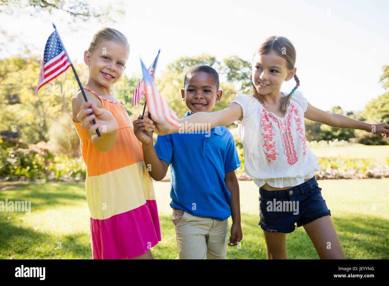 Happy children showing usa flag Stock Photo - Alamy