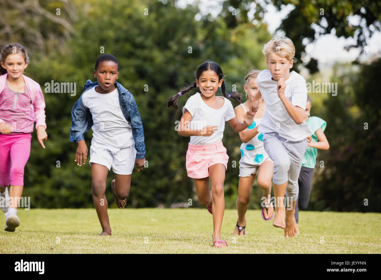 Kids playing together during a sunny day Stock Photo - Alamy