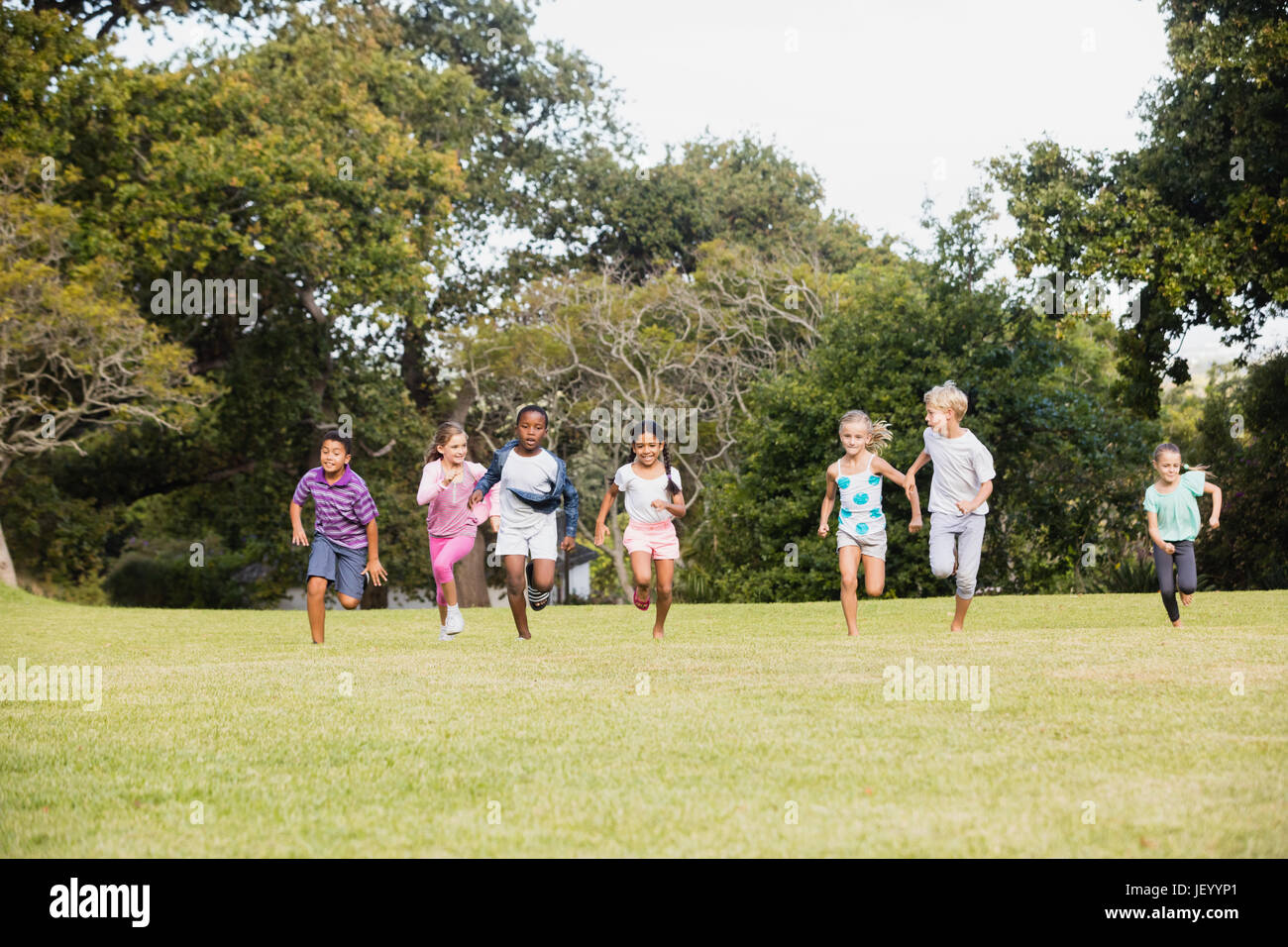 Kids playing together during a sunny day Stock Photo - Alamy