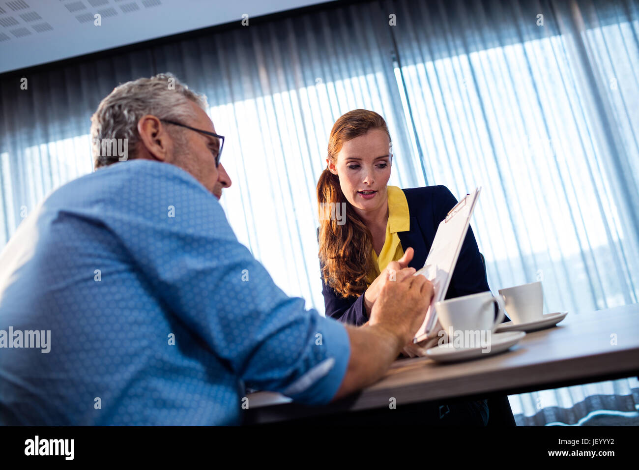 Two businessmen interacting Stock Photo - Alamy