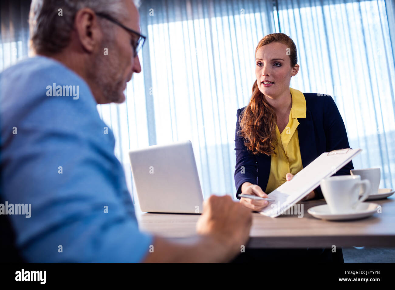 Two businessmen interacting Stock Photo - Alamy