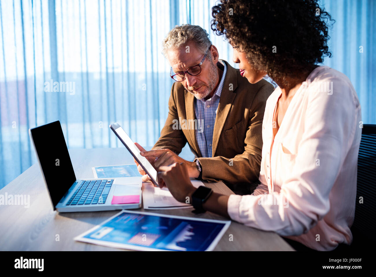 Two people working Stock Photo - Alamy