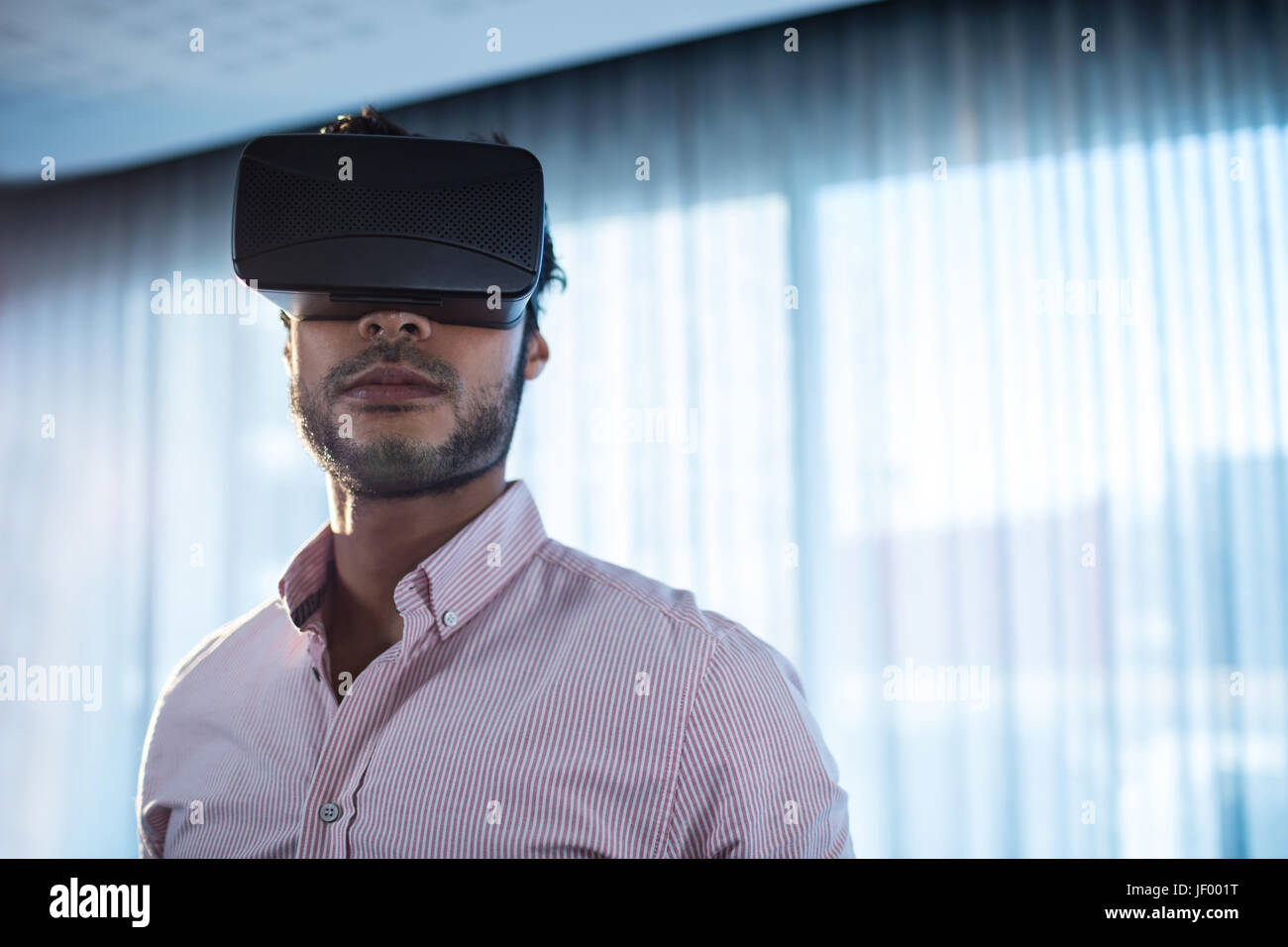 Businessman using an oculus Stock Photo - Alamy
