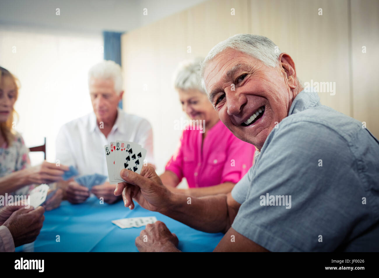 Group of seniors playing cards Stock Photo - Alamy