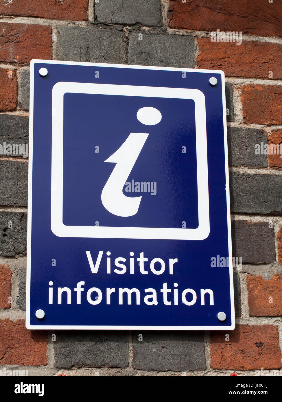 Visitor Information sign mounted on brick wall Stock Photo - Alamy