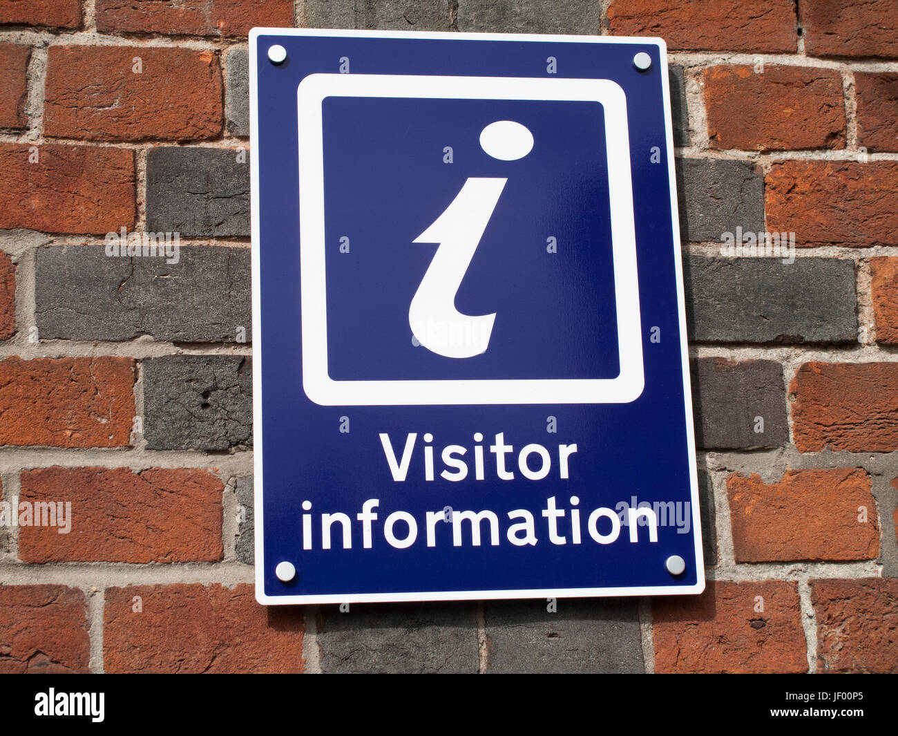 Visitor Information sign mounted on brick wall Stock Photo - Alamy
