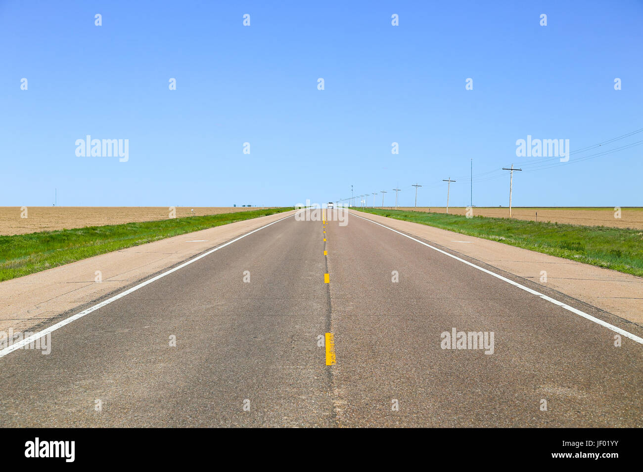 Highway through Fields Stock Photo - Alamy
