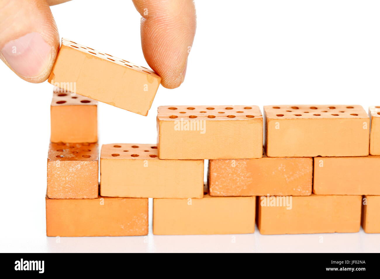 building a brick wall Stock Photo - Alamy