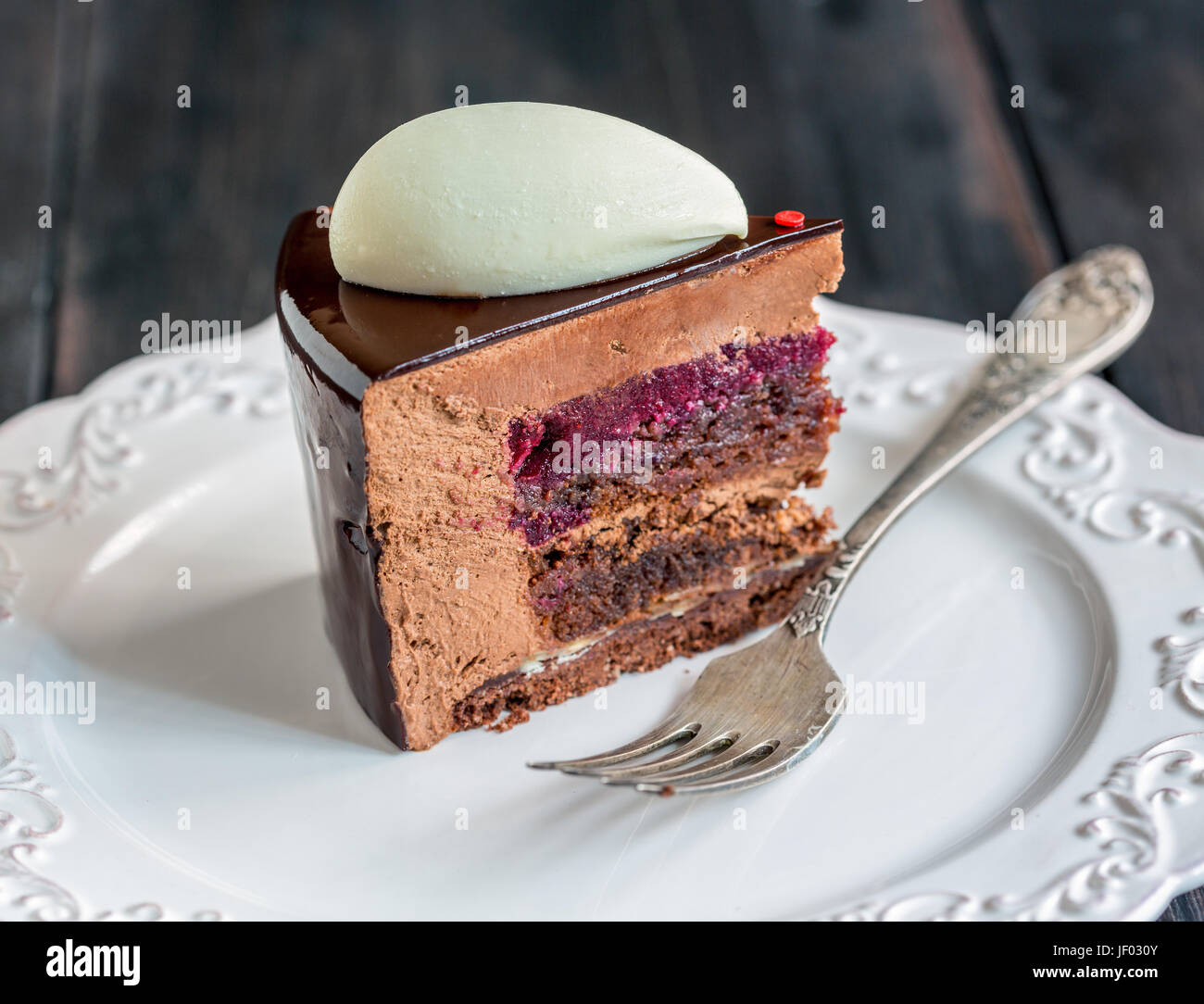 Piece of modern mousse cake with chocolate glaze Stock Photo - Alamy
