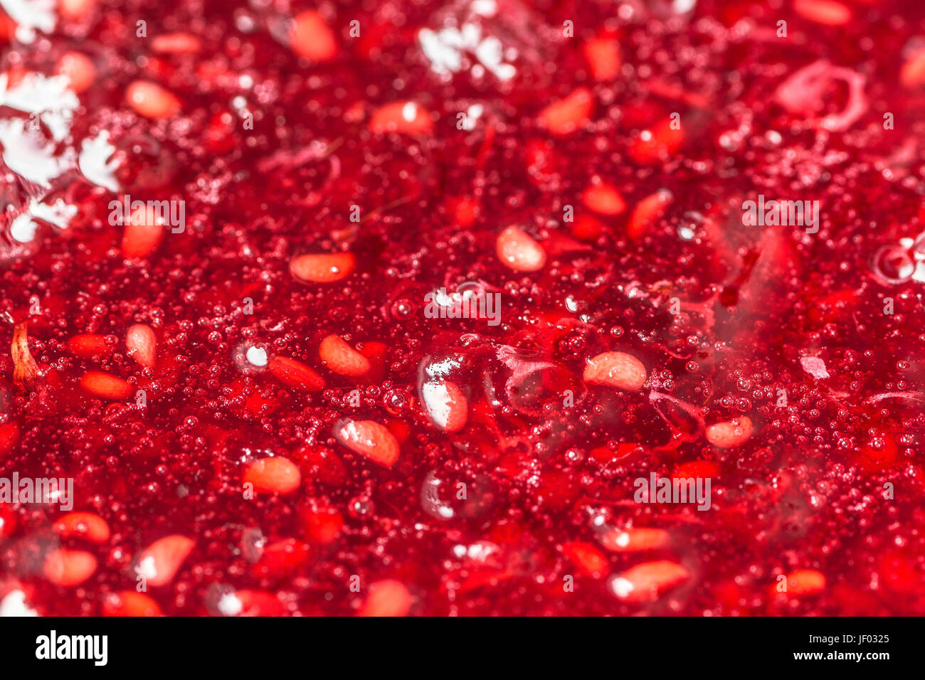 The surface of the red raspberry jam close up Stock Photo - Alamy