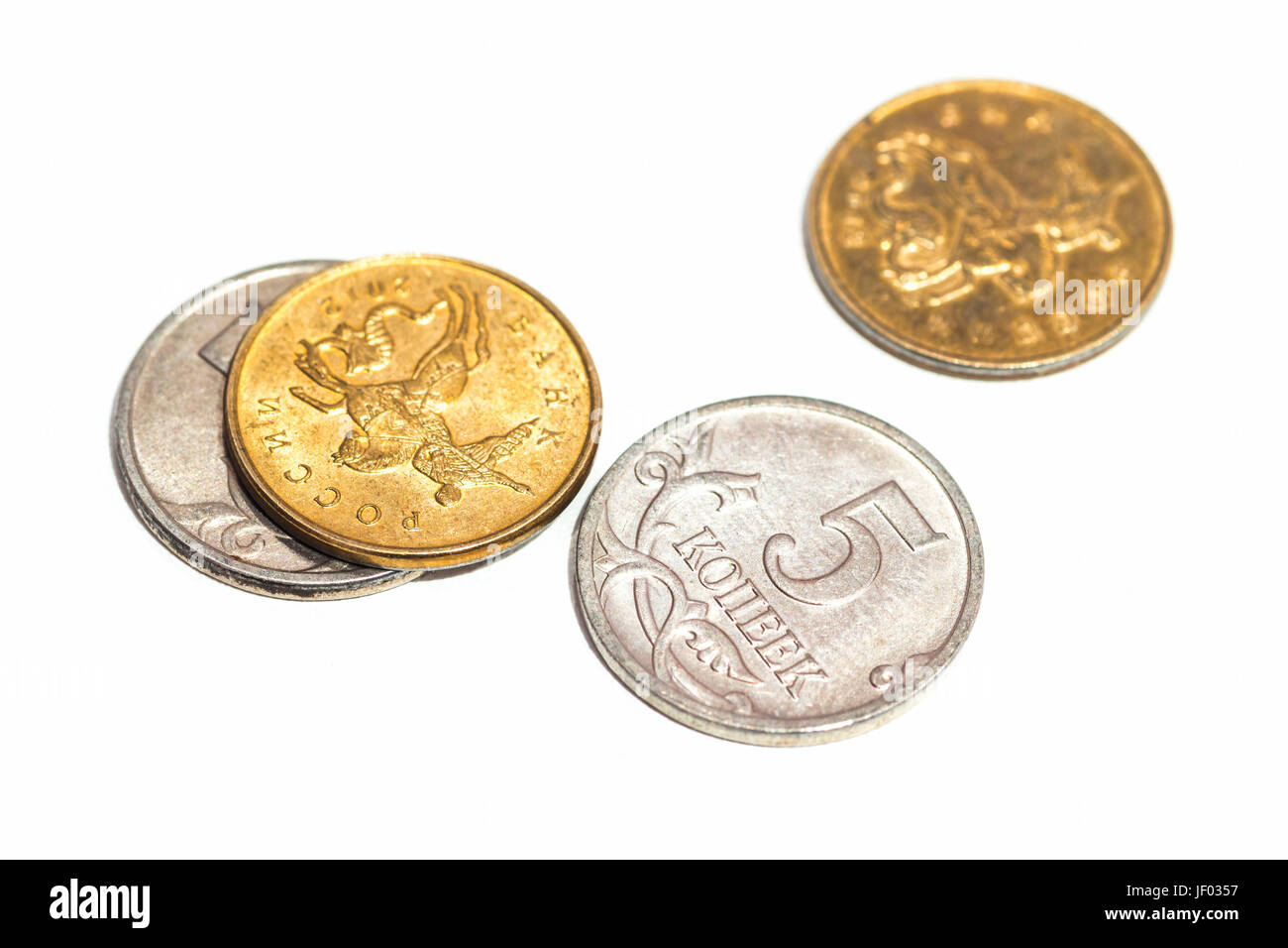 A few small coins close up on white background Stock Photo - Alamy