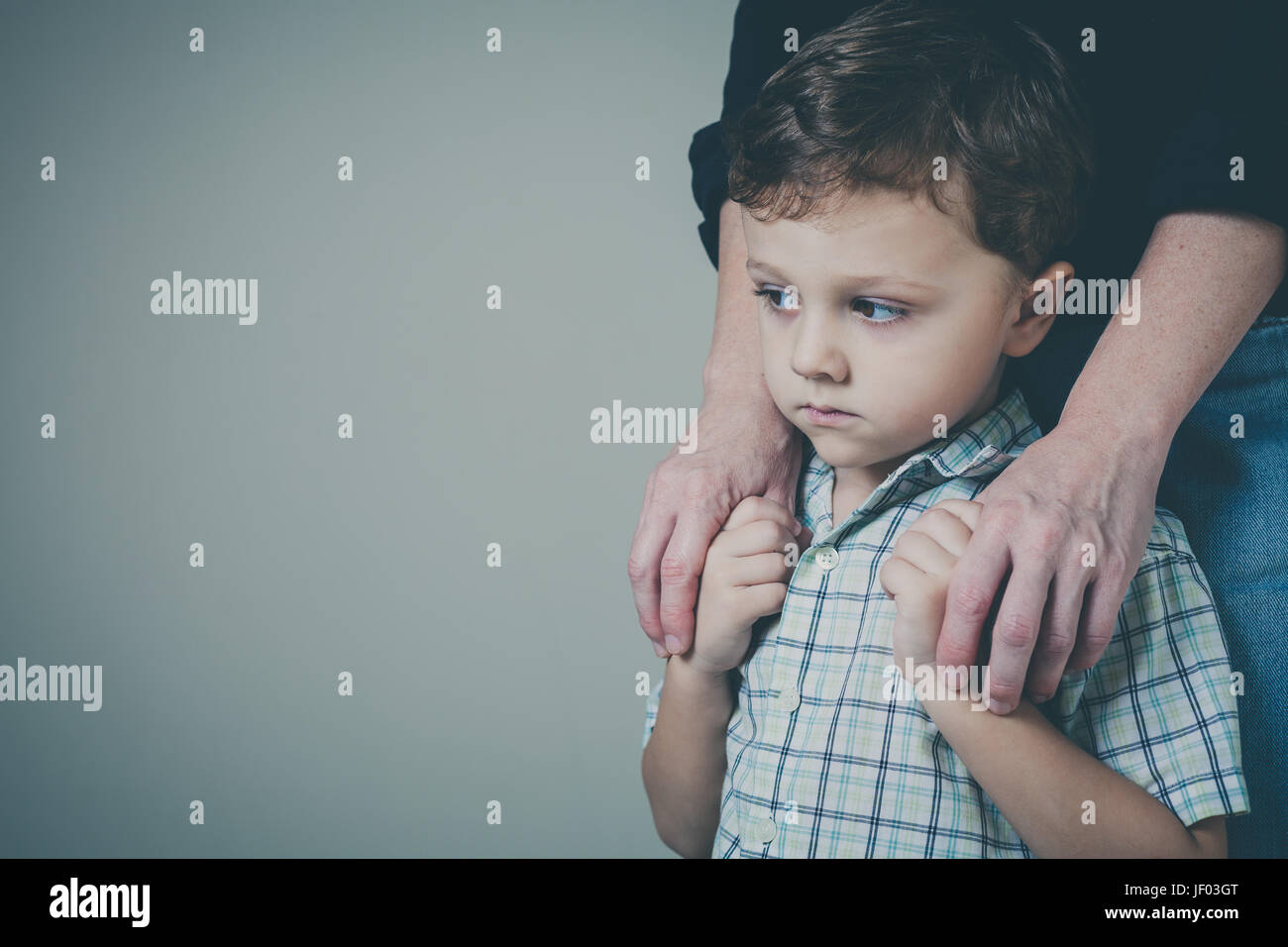 Son hug mother unhappy hi-res stock photography and images - Alamy