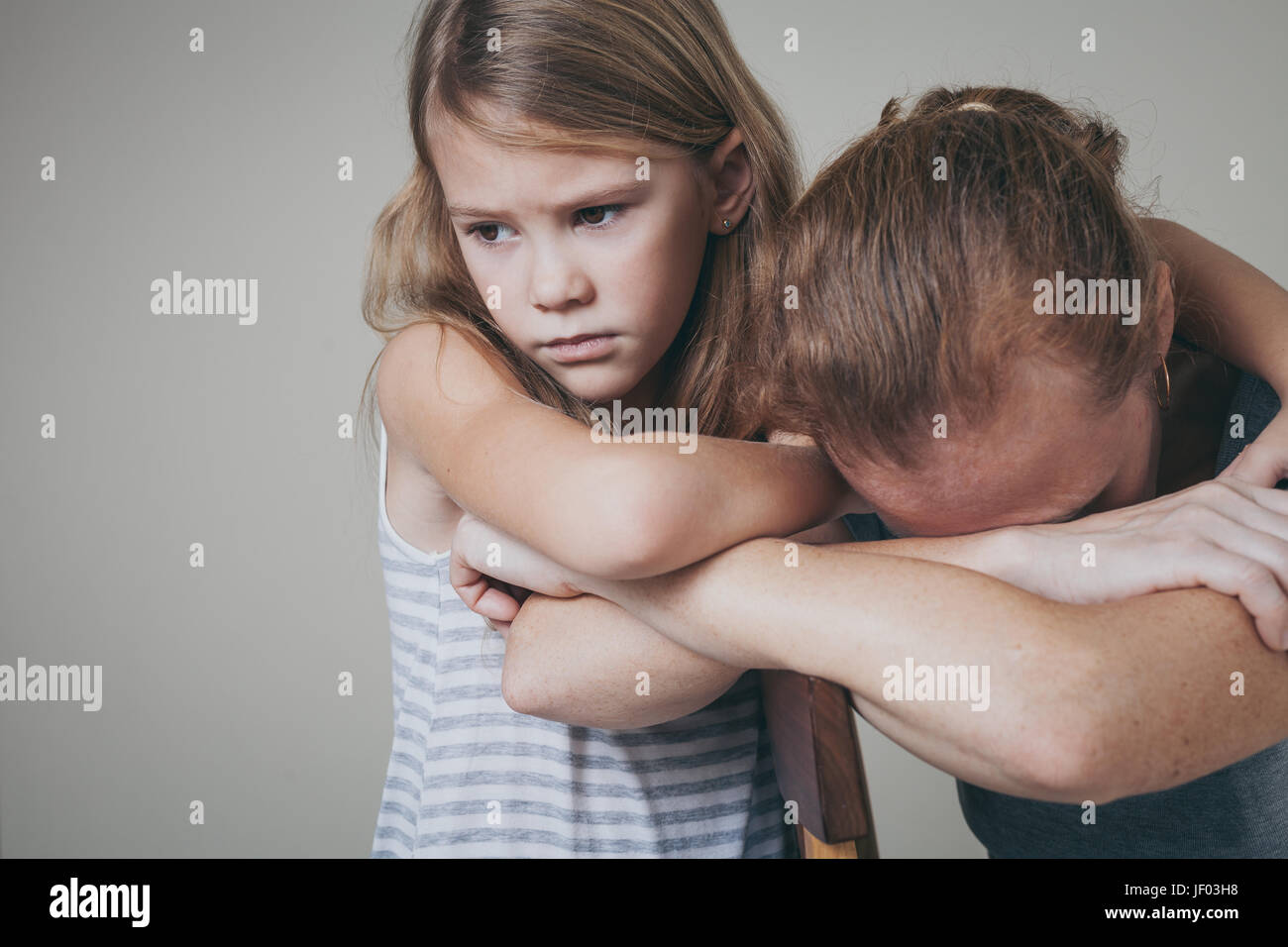sad daughter hugging his mother at home. Concept of couple family is in ...