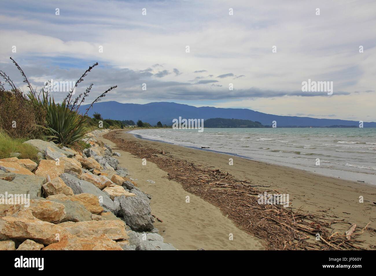 Cloudy day at Pohara Beach, New Zealand Stock Photo - Alamy