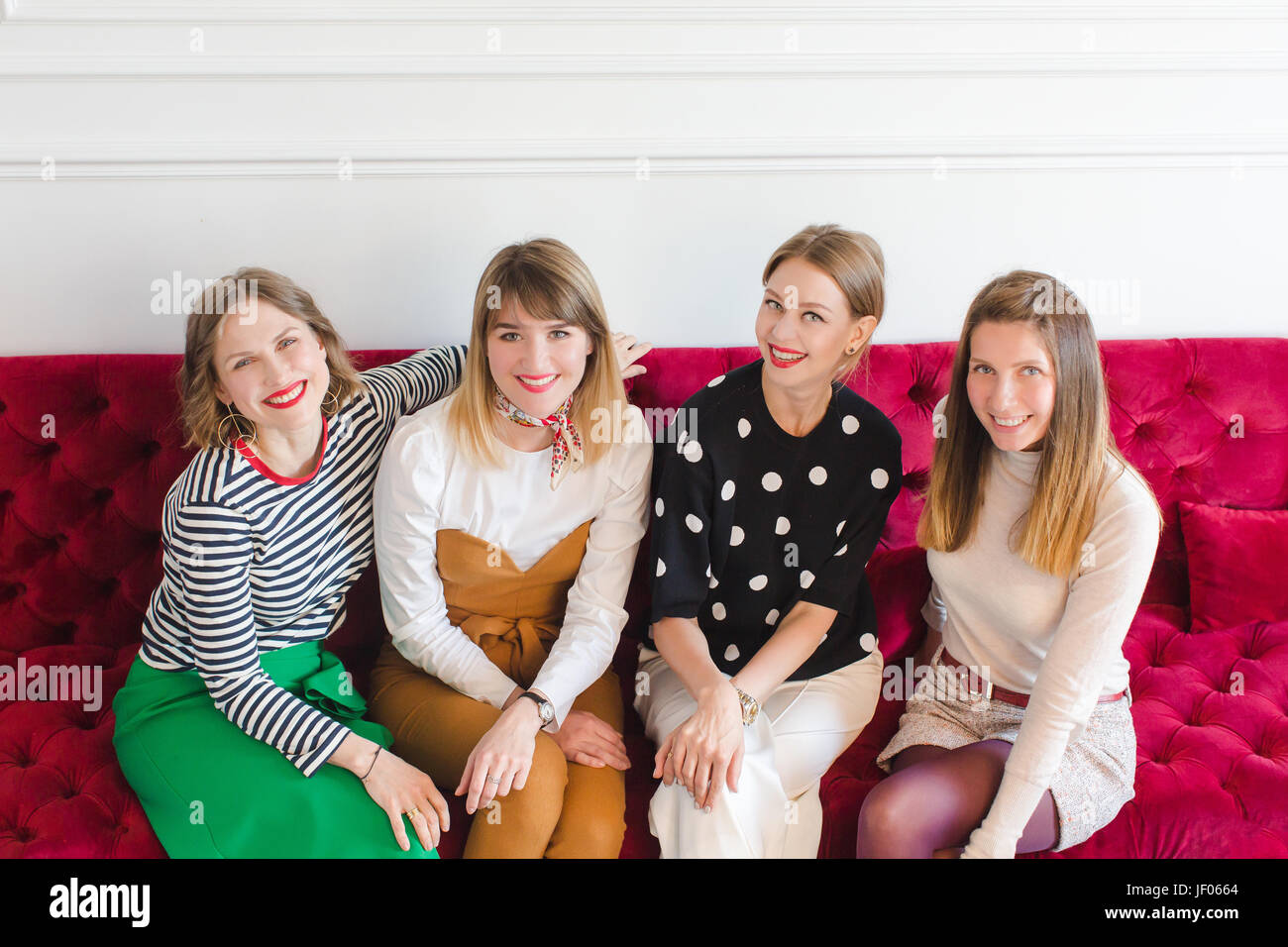 Group of people sitting together hi-res stock photography and images ...