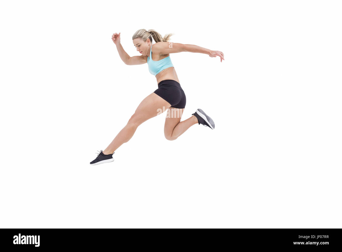 Female athlete jumping Stock Photo - Alamy