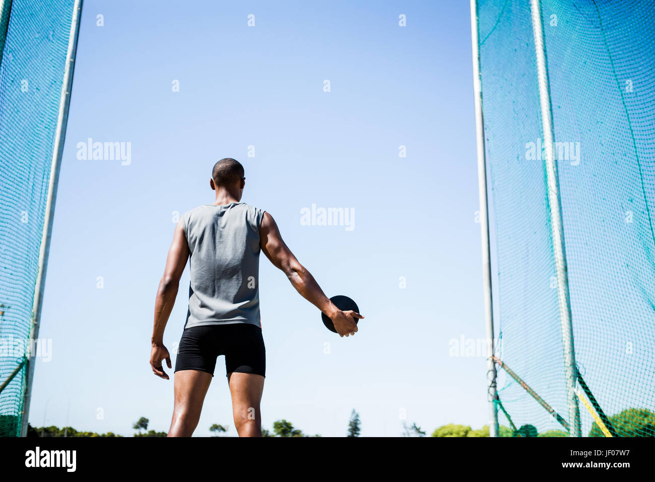 Athlete about to throw a discus Stock Photo - Alamy