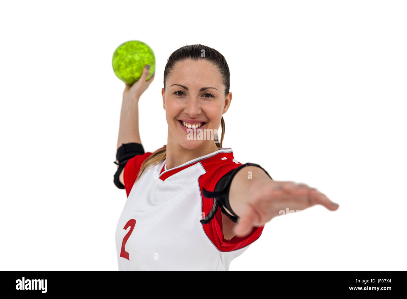 Sportswoman throwing a ball Stock Photo - Alamy