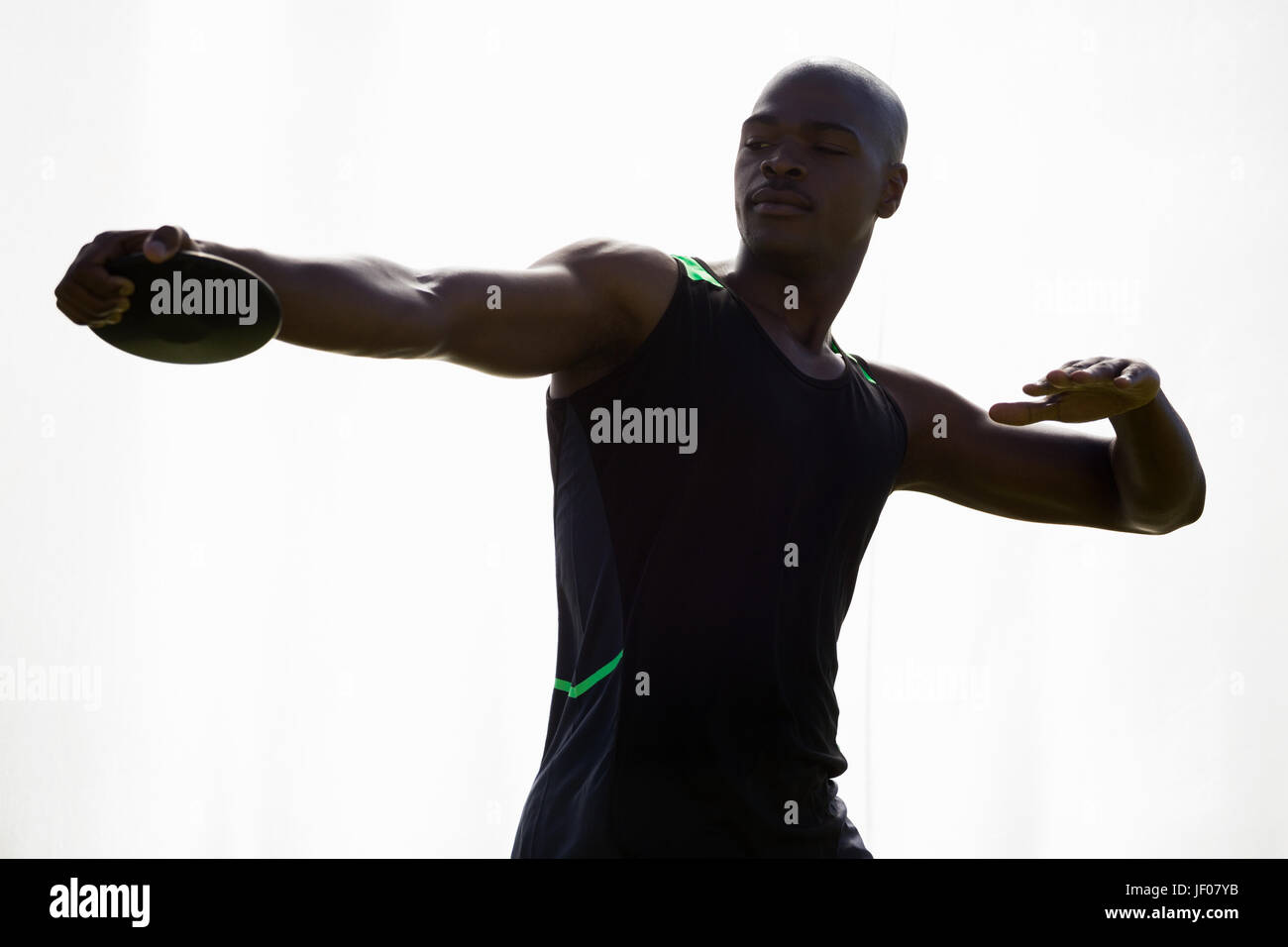 Athlete about to throw a discus Stock Photo - Alamy