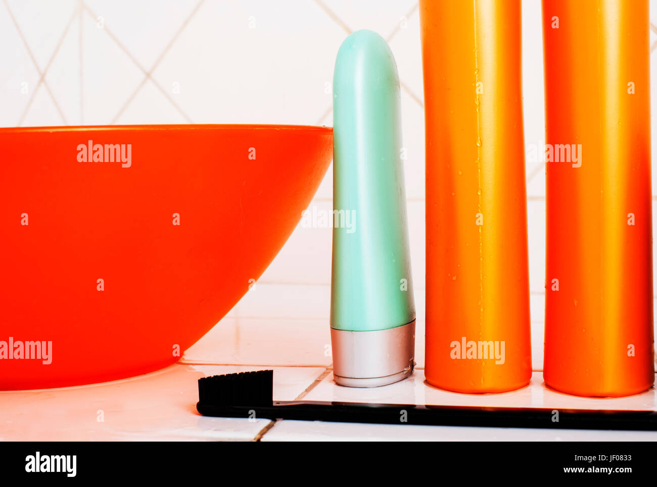 usual stuff in bathroom, shampoo, accessories, black stylish toothbrush ...