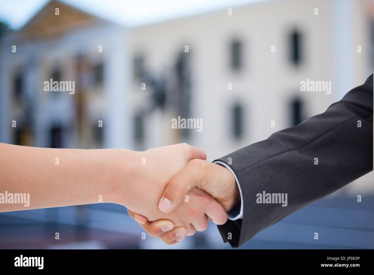 Composite image of a handshake Stock Photo - Alamy