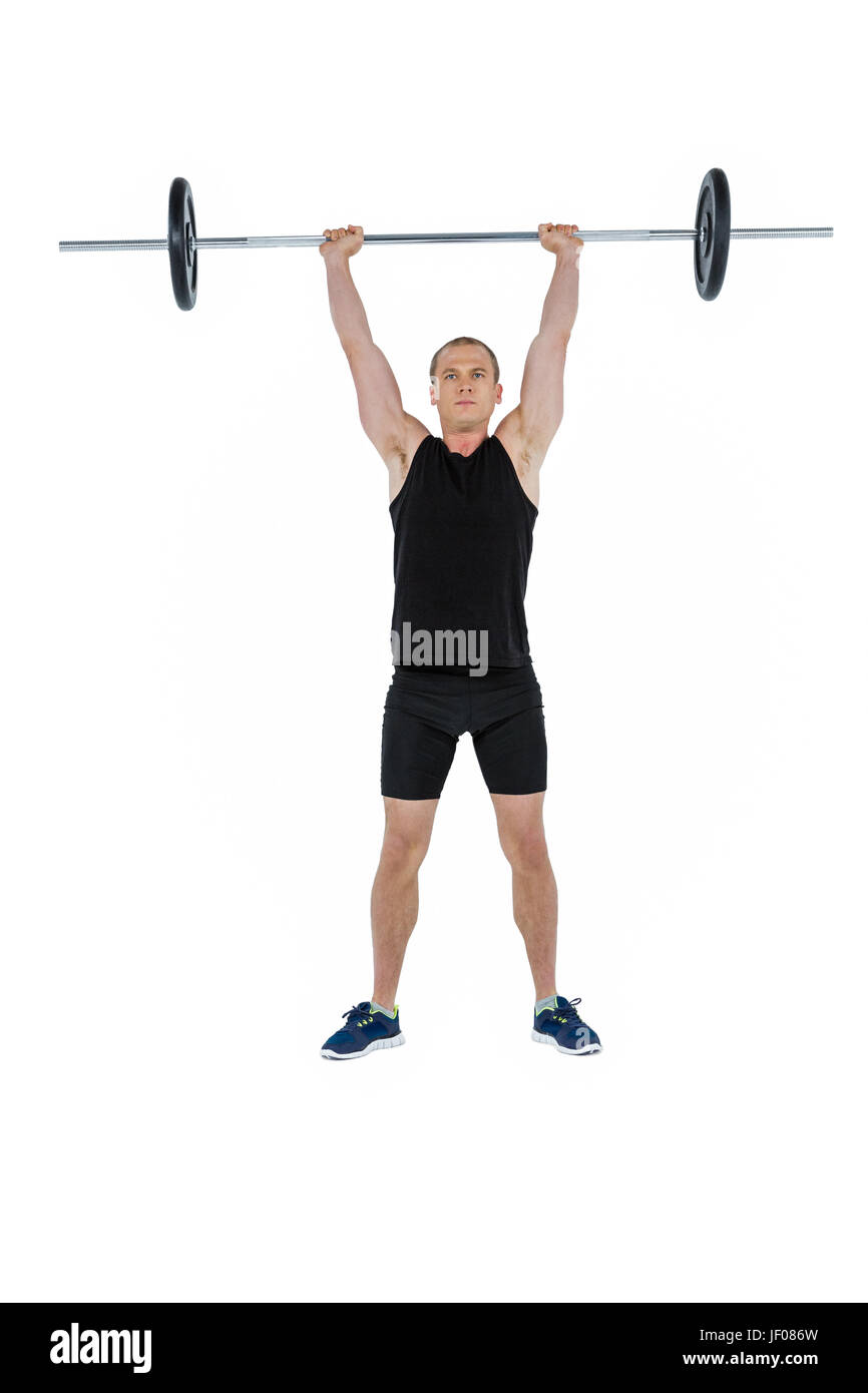 Bodybuilder lifting heavy barbell weights Stock Photo - Alamy