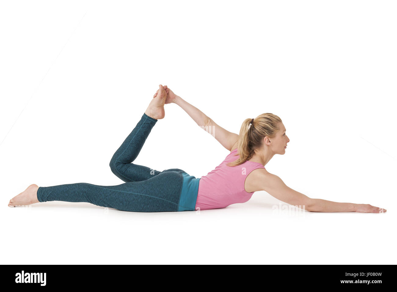 Yoga woman pink position 100 Stock Photo - Alamy