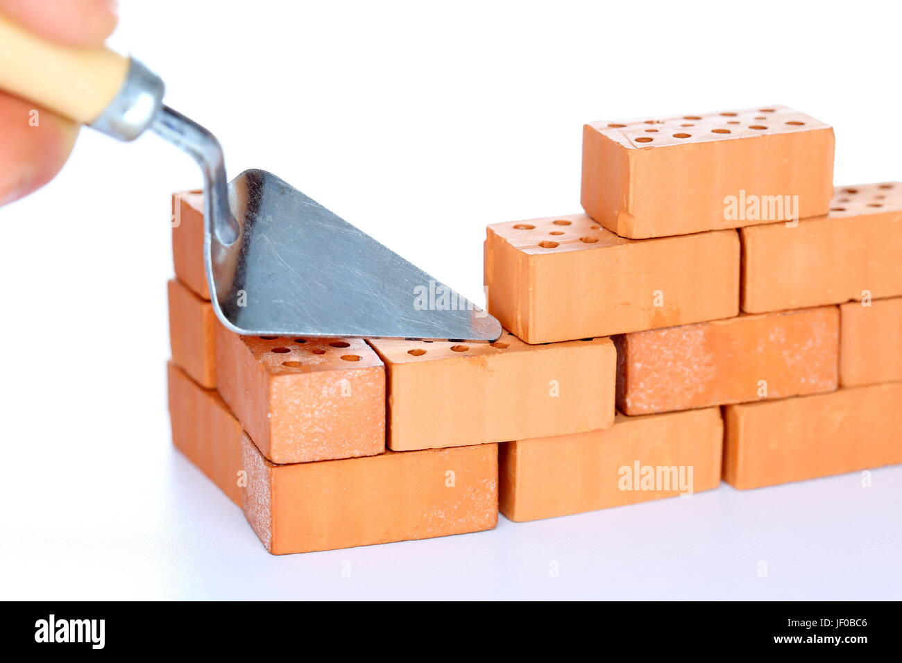 build up a wall Stock Photo - Alamy