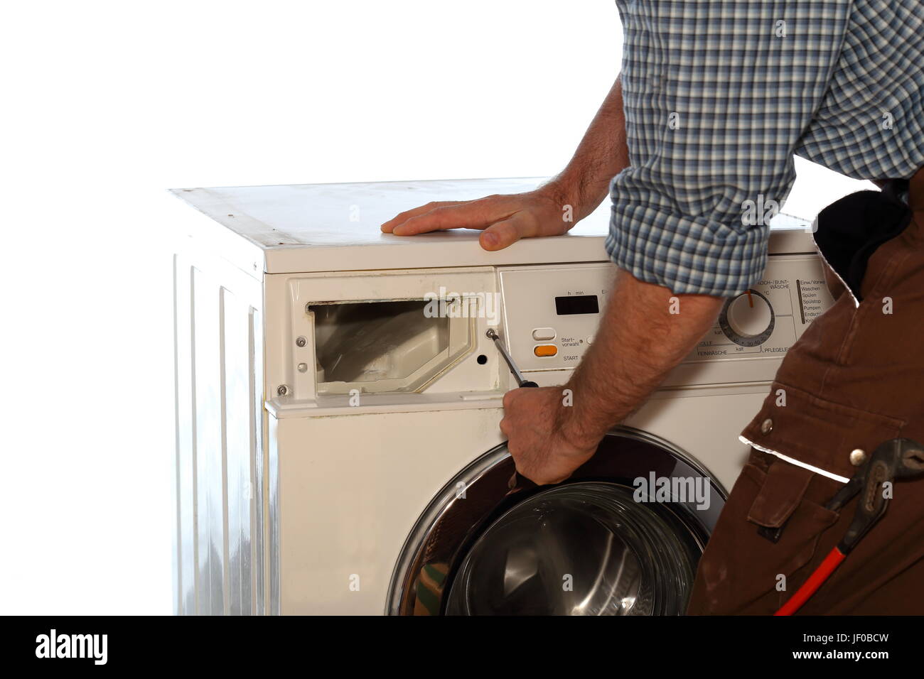 working on a washer Stock Photo - Alamy