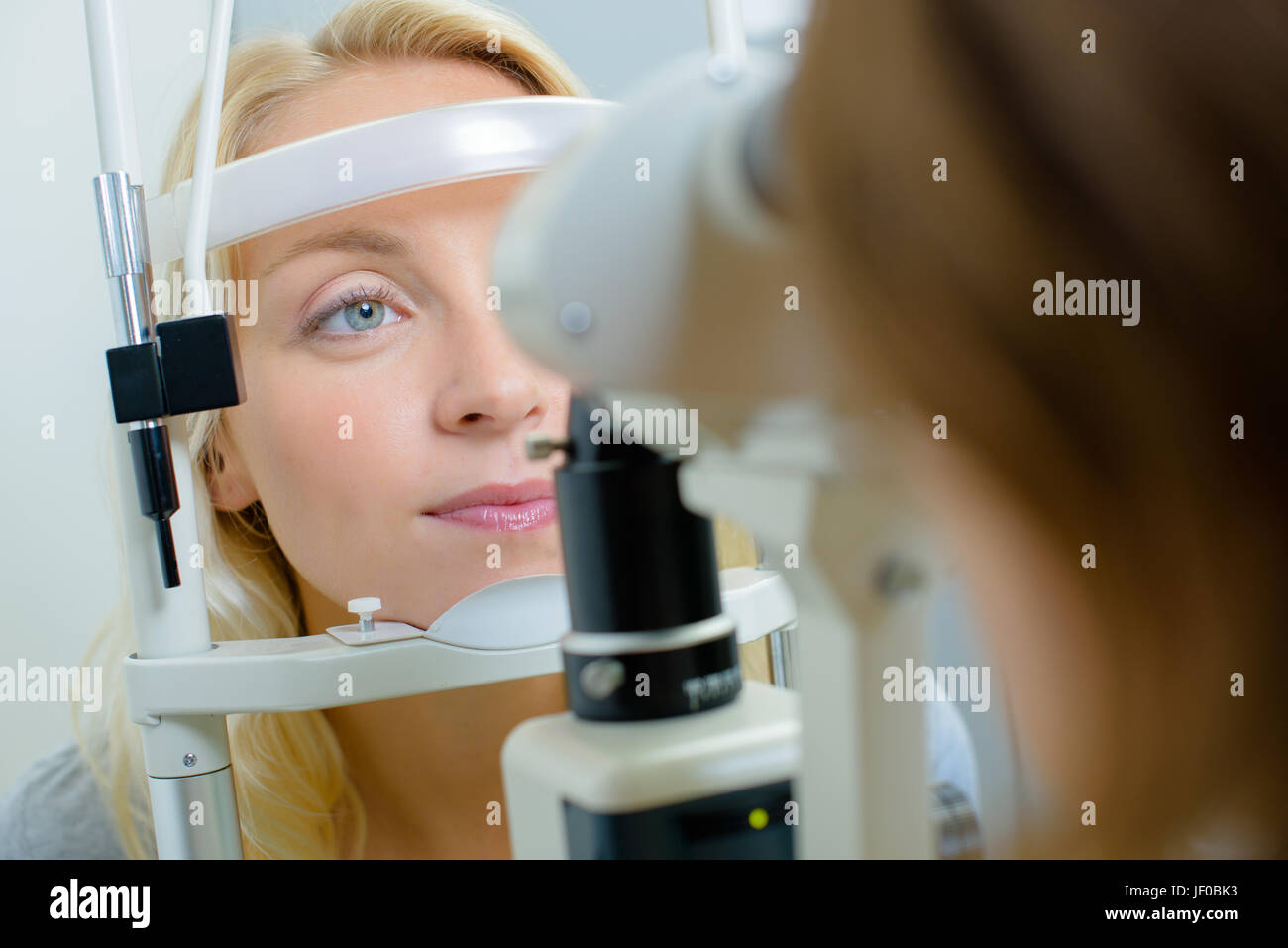 Closeup of lady having eye test Stock Photo - Alamy