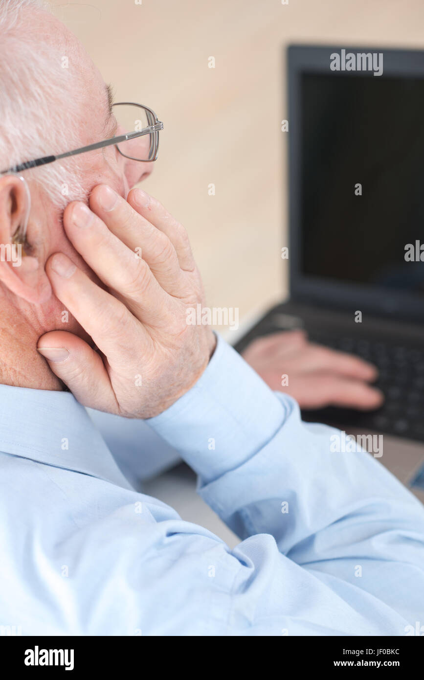 Elderly man using computer Stock Photo - Alamy